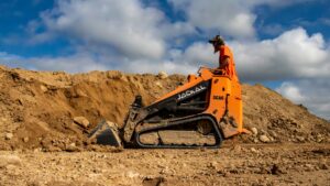 Jackal™ Stand-On Mini Skid Steer | Products | Scag®